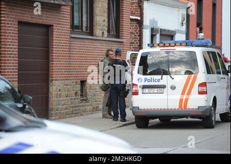 Police pictured on the scene of a hostage situation in Wanze, Wednesday ...
