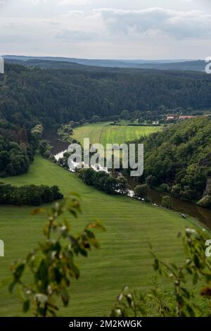 The Berounka river between mountains covered in forests in the Czech ...