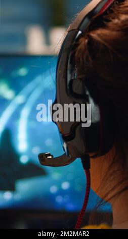 shoulder shot of professional gamer playing live video game on green ...