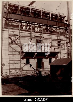 East wall of courtyard showing girder and balcony, construction of the ...