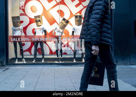 Illustration shows 'Sales' banners in a shop front window, at the ...