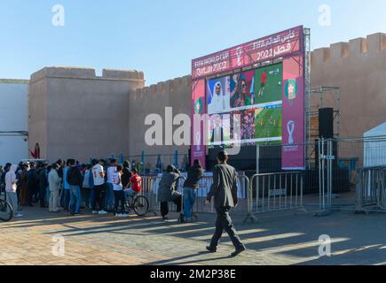Crowd watching big screen football match FIFA World Cup, Qatar 2022 ...