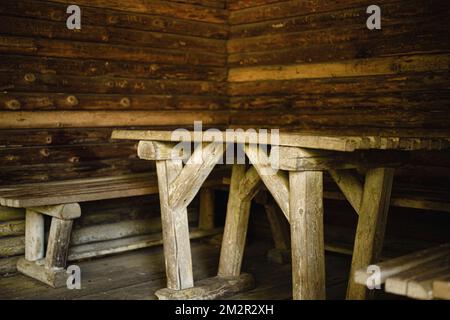 An interior of pavilion with wooden table and seats Stock Photo - Alamy