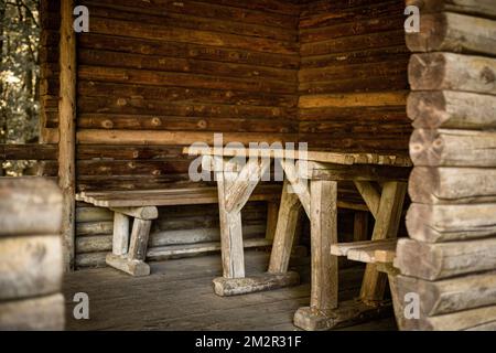 An interior of pavilion with wooden table and seats Stock Photo - Alamy