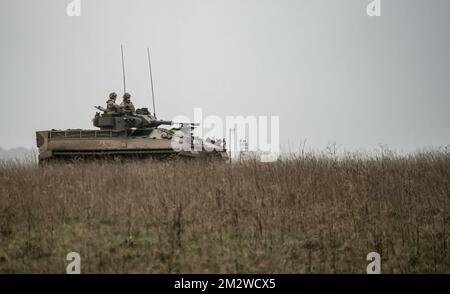 british army Warrior FV510 tank in motion on a military combat exercise ...