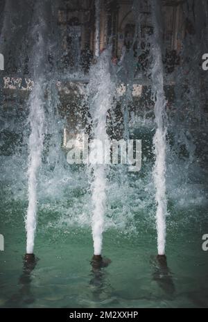 The fountains gushing sparkling water in a pool in a park Stock Photo ...
