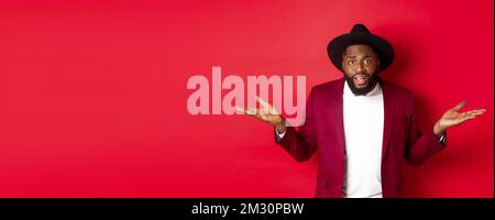 Image of confused Black man asking question, spread hands sideways and ...