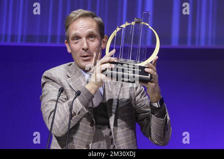 Salvatore Curaba, CEO of EASI holds up his trophy during the award ...