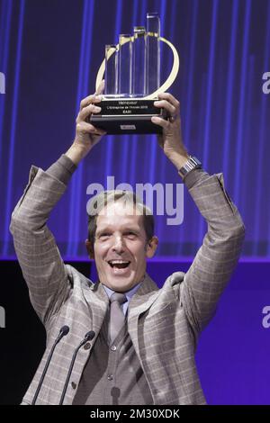 Salvatore Curaba, CEO of EASI holds up his trophy during the award ...