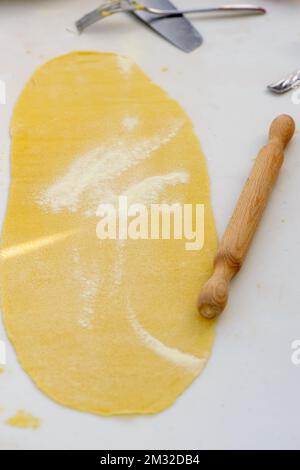 Making handmade pasta with wooden rolling pin Stock Photo - Alamy