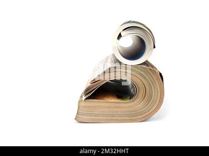 Rolled up magazines on a white background Stock Photo - Alamy