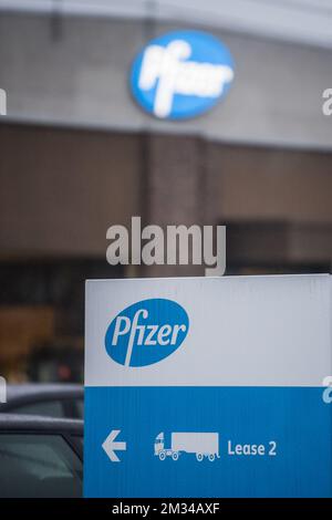 In this photo illustration the Pfizer logo seen displayed on a ...