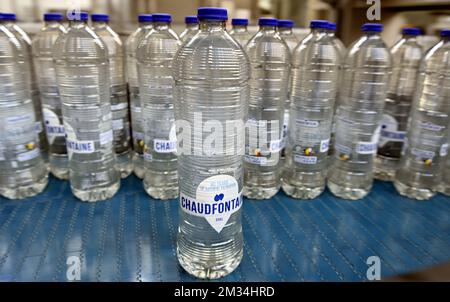 Illustration shows the production chain with bottles of water at the ...