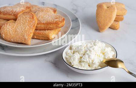 Heart-shaped cottage cheese biscuits for breakfast Stock Photo - Alamy