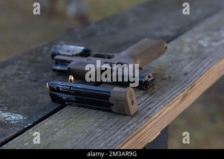 A cleared M18 pistol lays on the firing line during the pistol team ...