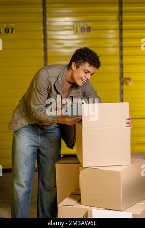 Service man checking the boxes aand looking excited Stock Photo - Alamy