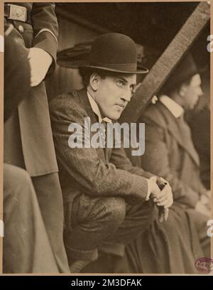Boston Red Sox owner John Henry, left, gestures before a baseball game ...