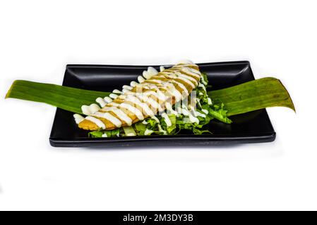 Taco xochimilco friend with masa dough lettuce and sour cream on black ...