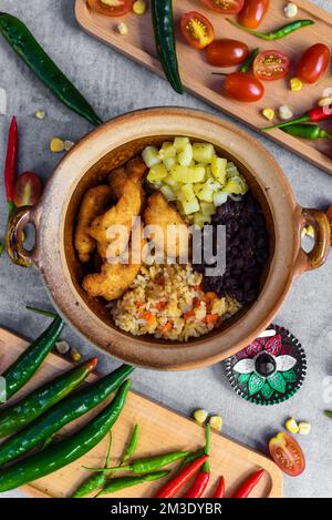 Mexican tradition dish Cazuela with fried chicken, beans rice and ...