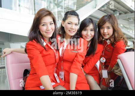BANGKOK - OCT 27: Airasia crew members in Bangkok Airport on October 27 ...