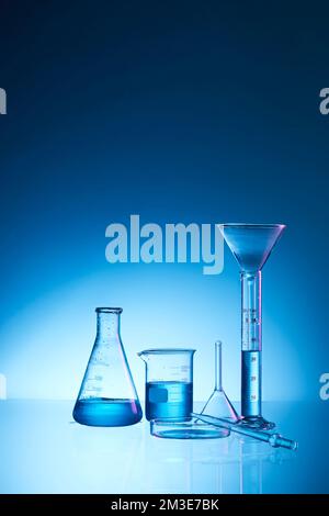 science lab with clear blue background and test tubes with blue ...
