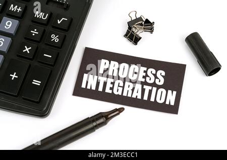 the inscription SOLUTION INTEGRATION on the plate in the hands of a ...