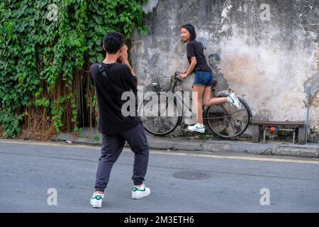George Town, Malaysia - November 2022: Tourists taking pictures with a ...