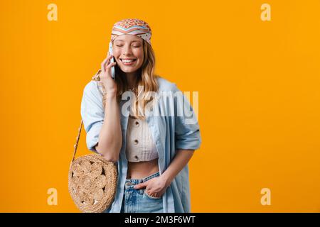 Young woman wearing bandana talking with friend at sidewalk cafe Stock ...