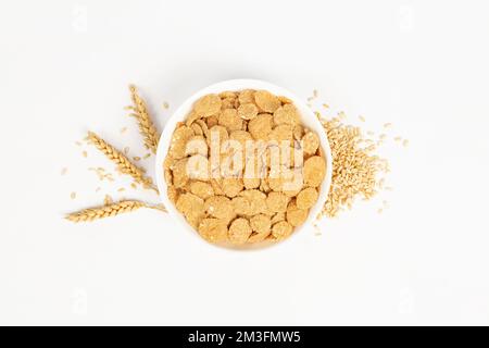 wheat spike next to bowl of corn flakes Stock Photo - Alamy