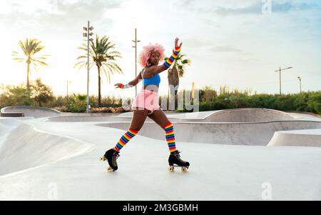 Beautiful woman skating with roller skates and having fun. Professional ...