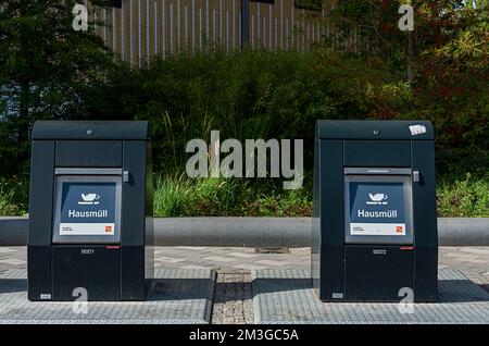 Modern household waste containers in front of new buildings in ...