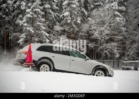 Red and white bulldozer parked by the road at a construction site Stock ...