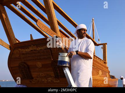 Doha, Qatar, 15th November 2022. A Qatar flag is carried aboard a local ...