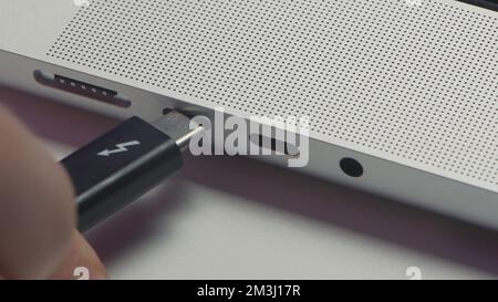 insert USB type c plug into USB port on laptop computer Stock Photo - Alamy