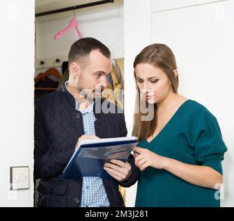 Caseworker helping woman polling questionnaire Stock Photo - Alamy