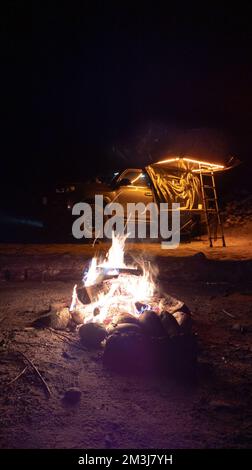 A vertical shot of a big bonfire at night Stock Photo - Alamy