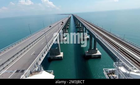 Huge white bridges over the ocean. Shot.Paved roads connecting the ...