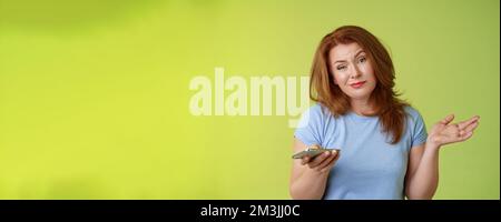 Well meh. Indifferent careless hesitant redhead middle-aged woman ...