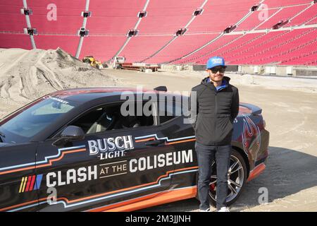 Kyle Larson poses with Chevrolet pace car during 2023 Busch Light Clash ...