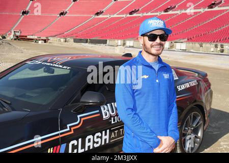 Kyle Larson poses with Chevrolet pace car during 2023 Busch Light Clash ...