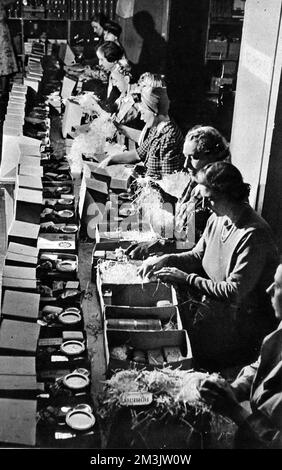 Red Cross workers packing parcels for prisoners of war in 1942. Red ...