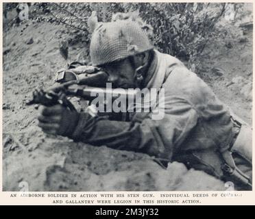 A soldier of the British First Airborne Division firing his Sten gun at ...
