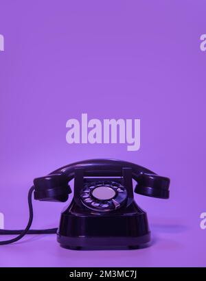 Old violet telephone with rotary dial isolated on white Stock Photo - Alamy