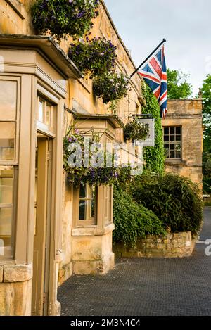 Box bay window or canted window of Cotswold stone in the market town of ...