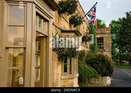 Box bay window or canted window of Cotswold stone in the market town of ...