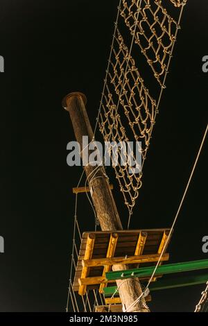 Fun and hard adventure park captured in the nighttime Stock Photo - Alamy