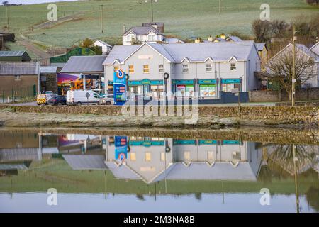Foley's Centra, Timoleague, reflected in tidal estuary. Dec 2022 Stock ...