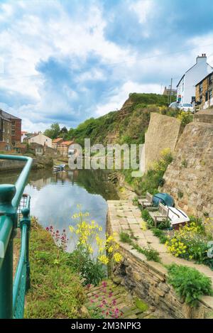 Looking west up Staithes Beck (river) at the quaint ancient fishing ...