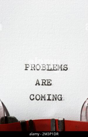 Problems are coming text written with a typewriter in a white puzzle ...