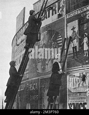 Billposters at work Stock Photo - Alamy